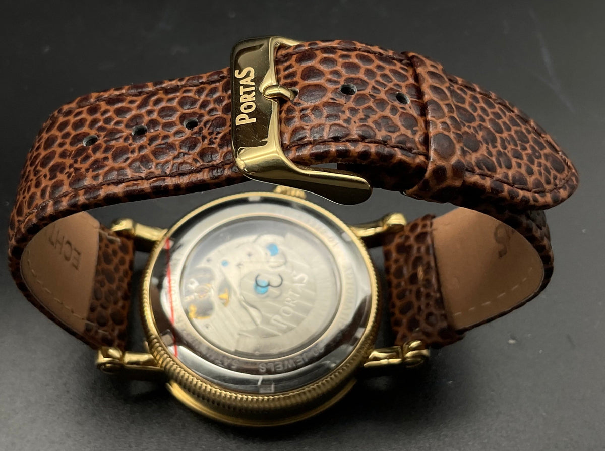 Gold-braune Portas Uhr – Martin Bode